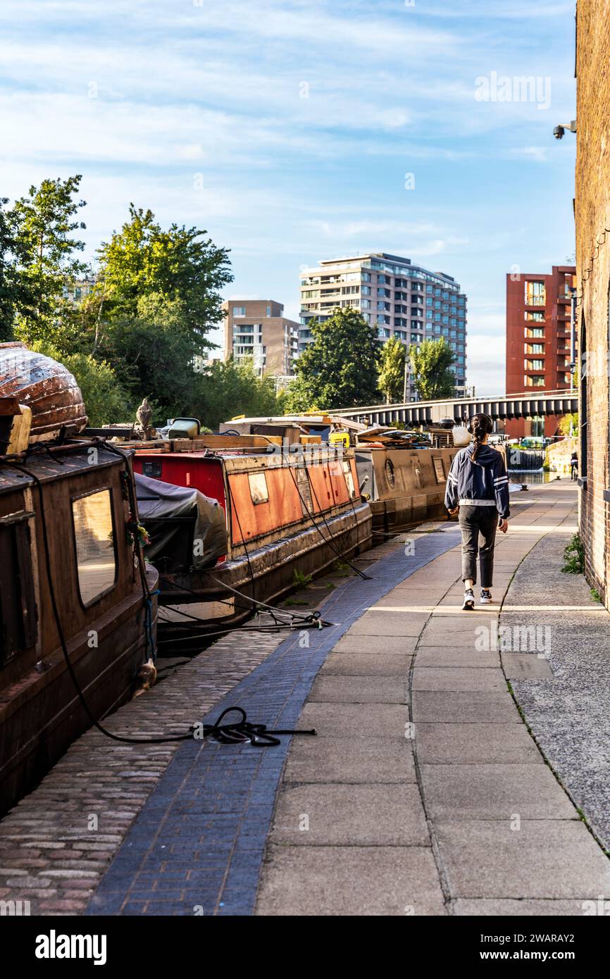 People walking along Regent’s Canal Towpath near Somers Town Bridge ...