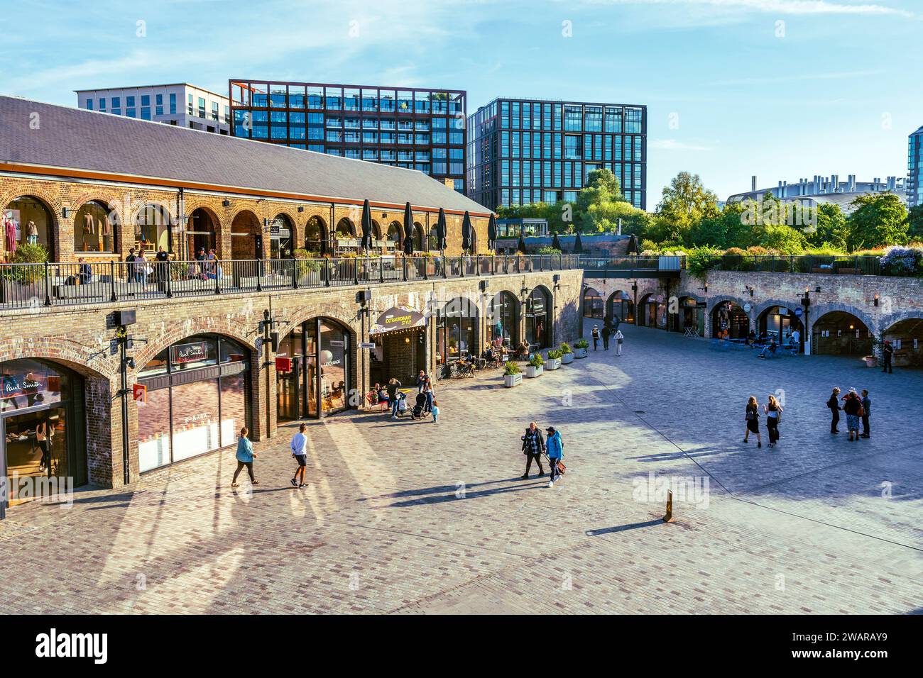 People walking in Coal Drops Yard, in redeveloped King's Cross Central ...