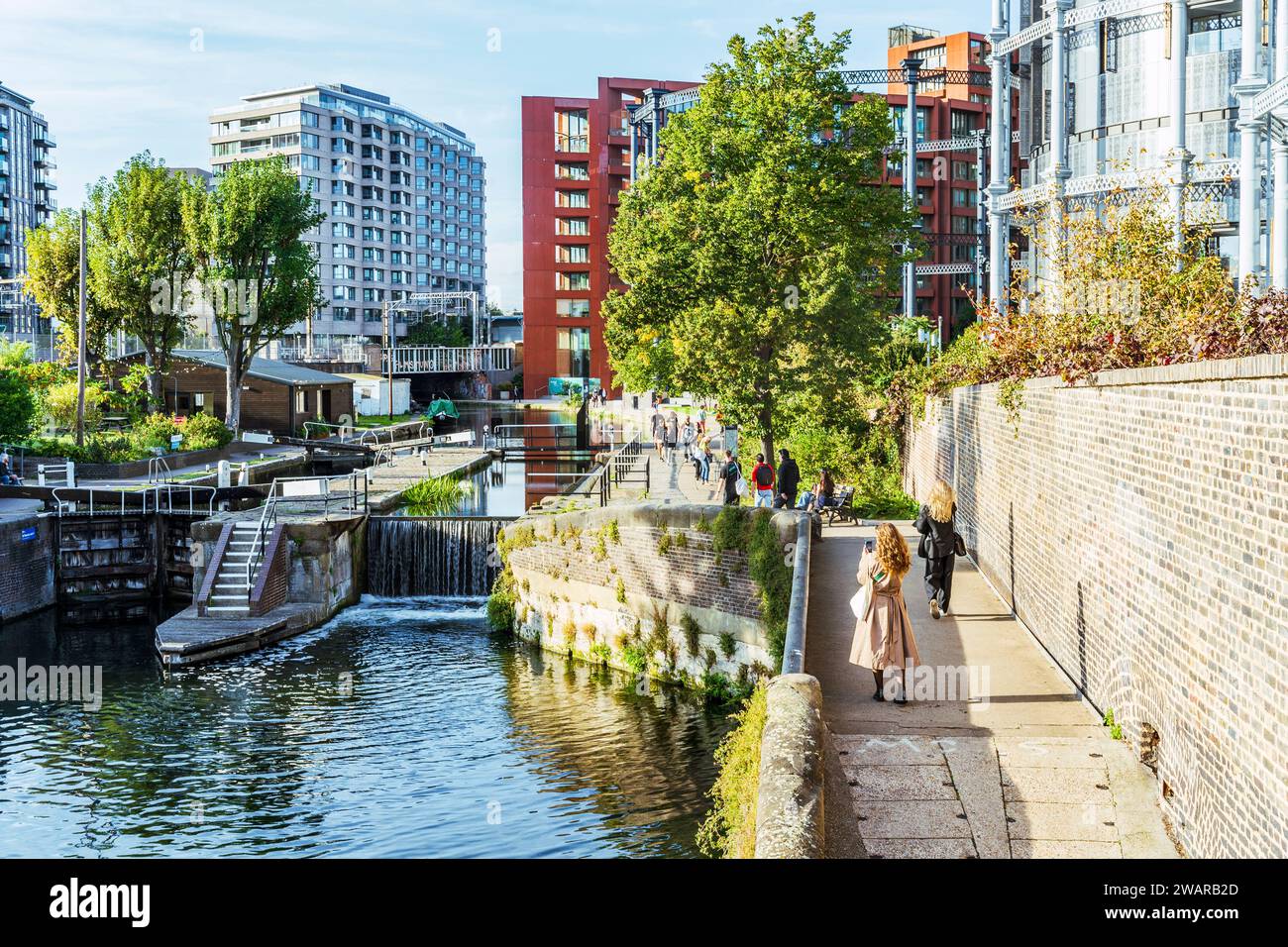 People walking along Regent’s Canal Towpath near Somers Town Bridge ...