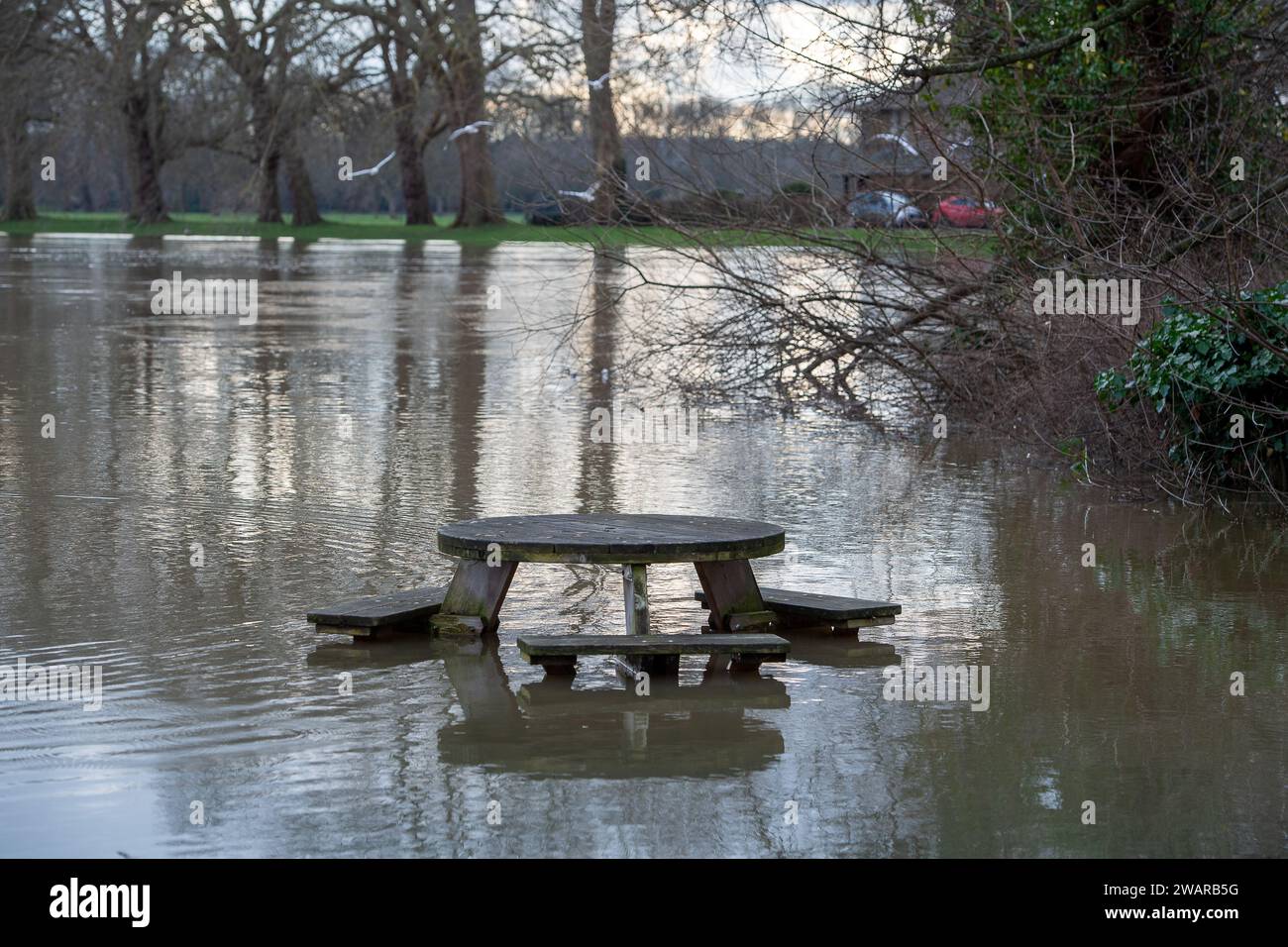 Datchet, Berkshire, UK. 6th January, 2024. A submerged picnic table by ...