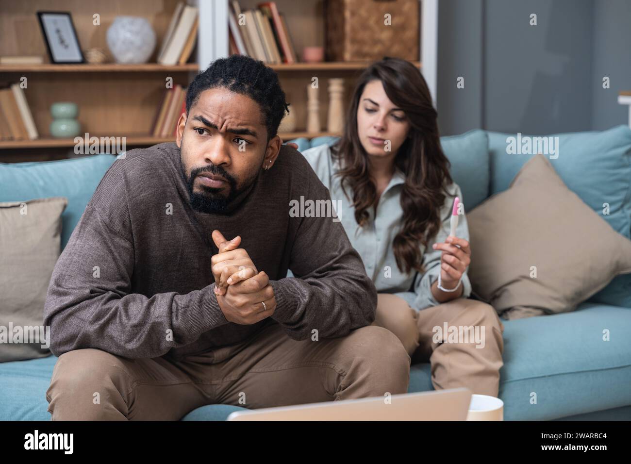 Young couple man and woman argue after she find out that she is ...