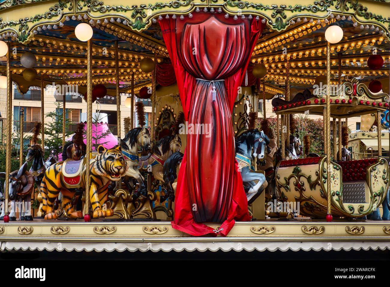 A cheerful amusement carousel in Merano, South Tyrol, Italy Stock Photo ...