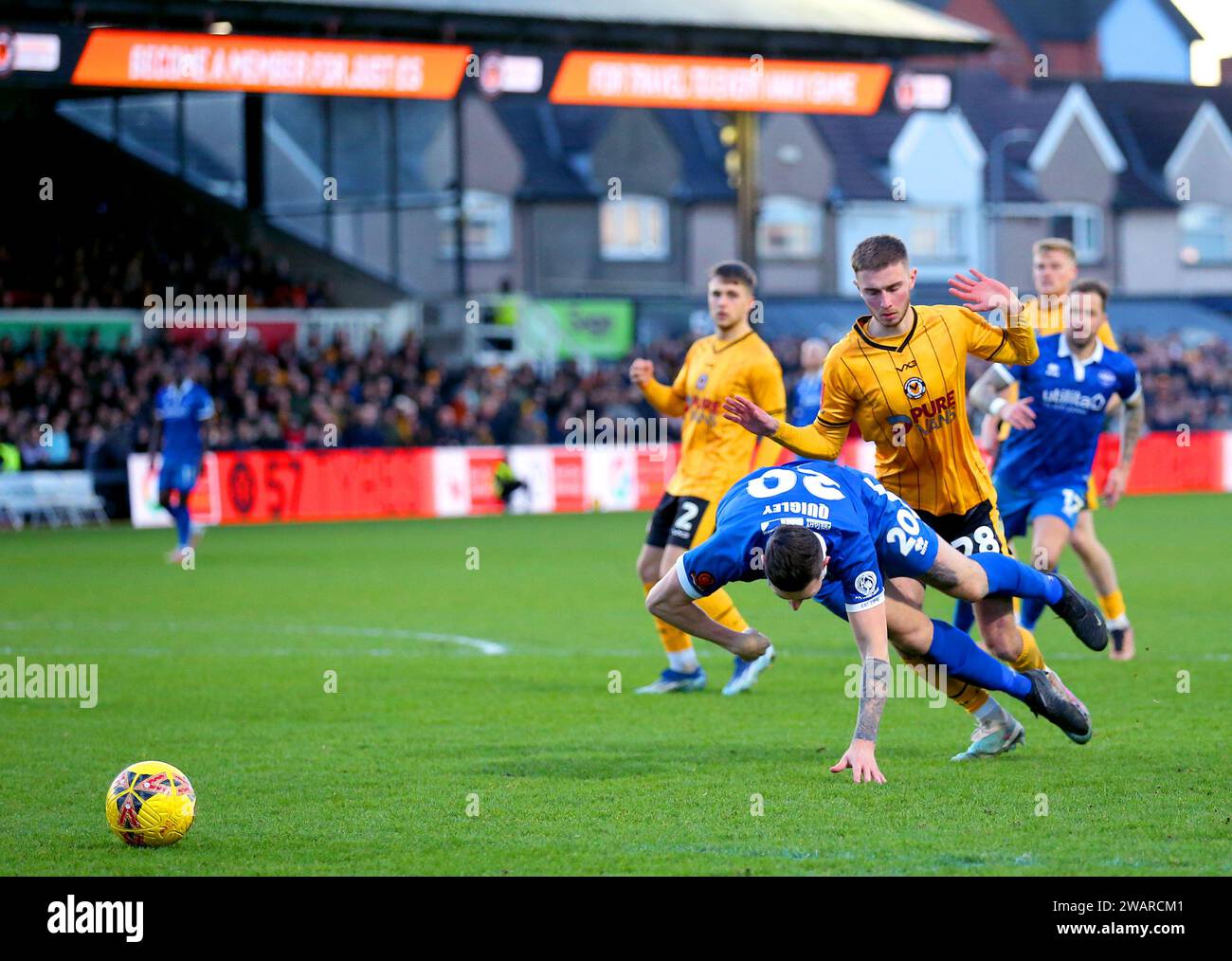 Eastleigh's Scott Quigley goes down in the box following a challenge ...