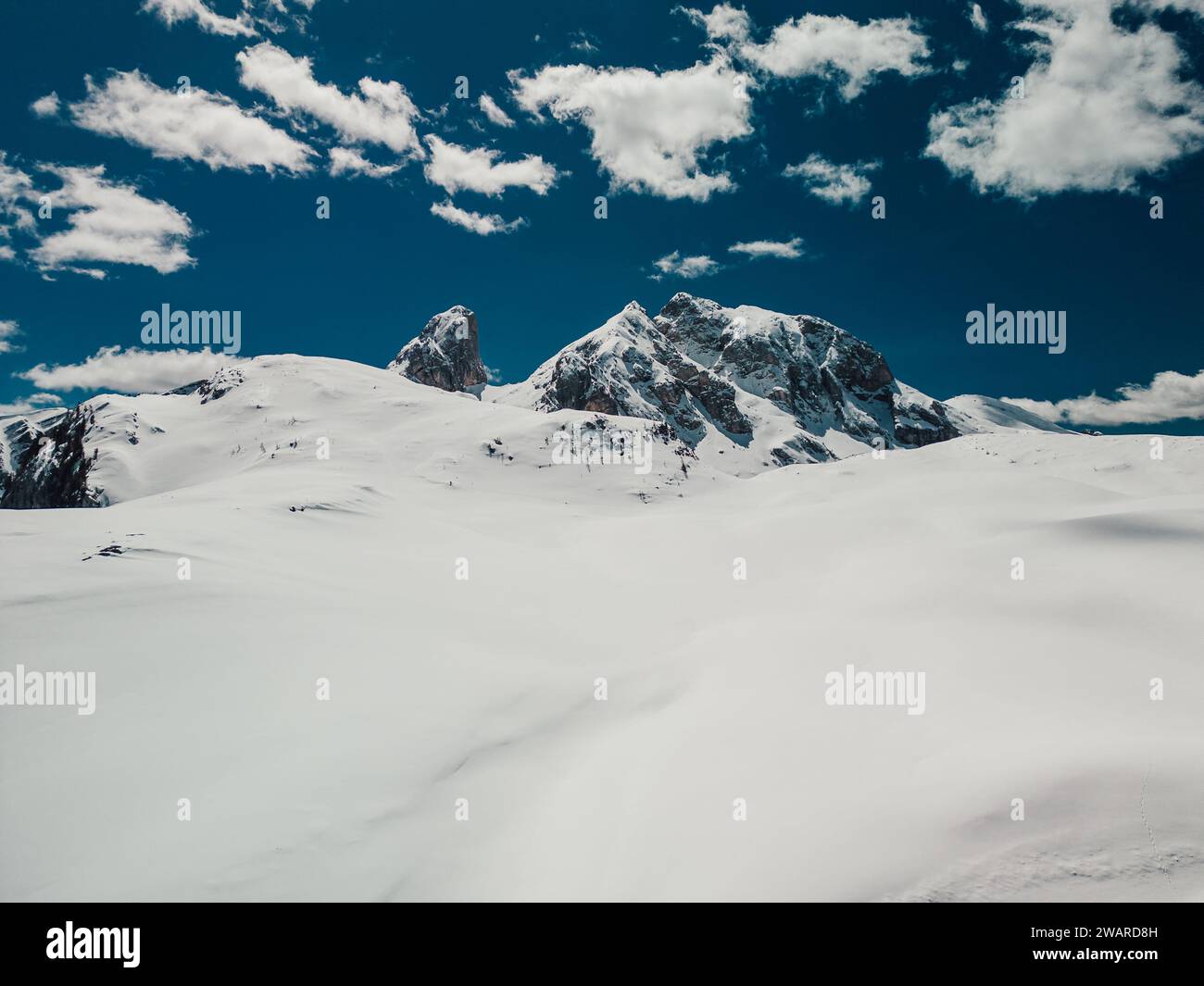 This aerial view showcases a picturesque landscape of a mountain range ...