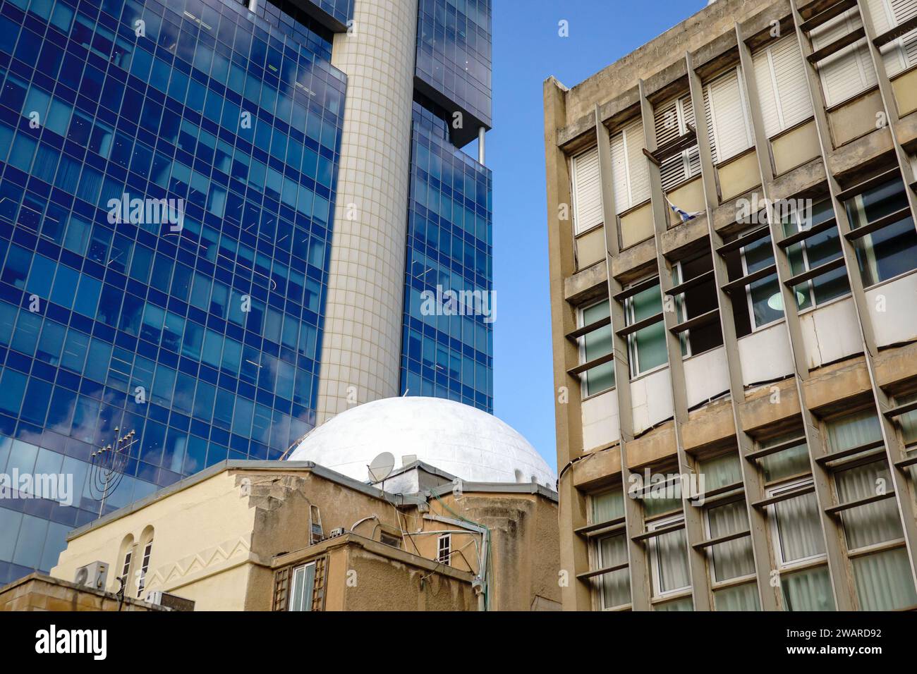 Contrast of old and new architecture with a domed building flanked by ...