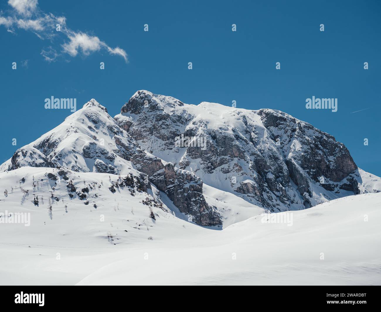 This photograph captures a scenic winter landscape featuring snow ...