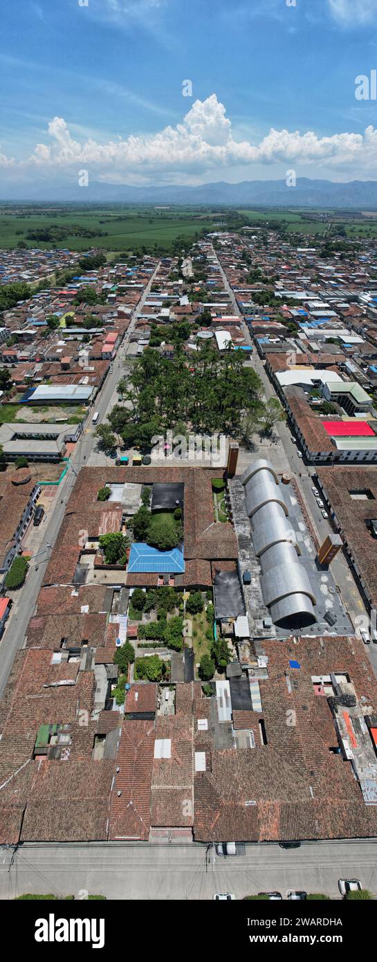 An aerial view of a street lined with buildings on both sides ...