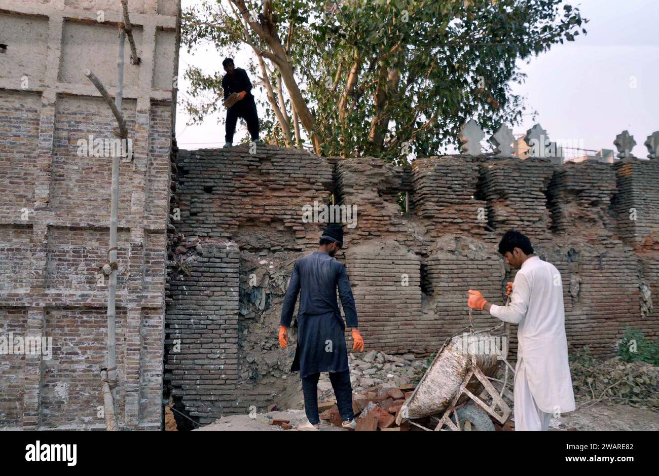 Laborers are busy in renovation and construction works of Pakka Qila ...