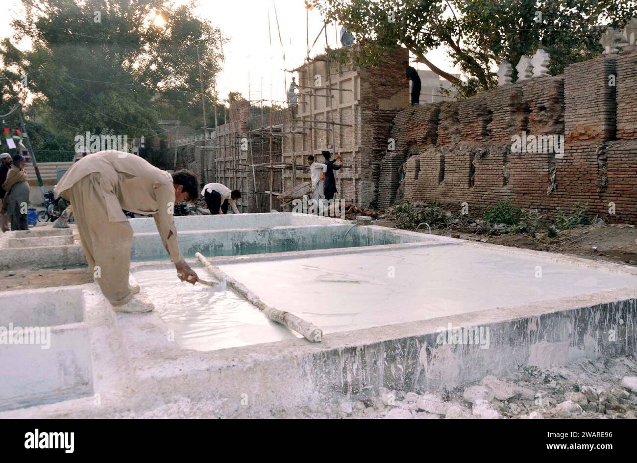 Laborers are busy in renovation and construction works of Pakka Qila ...