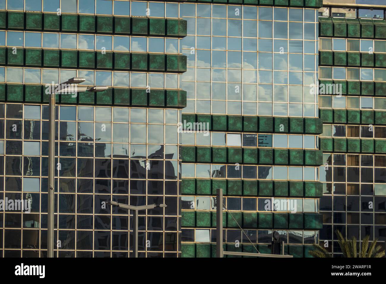 Reflective glass facade of modern buildings creating a mesmerizing ...