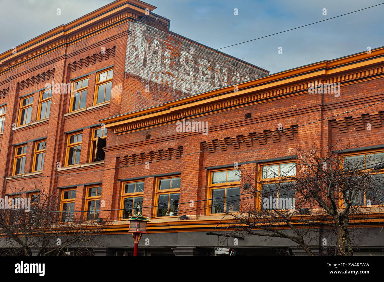 Renovated facade of red brick architecture in Chinatown Victoria ...