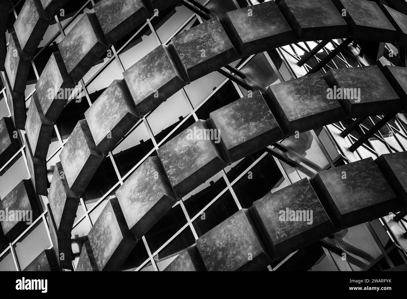 Monochromatic geometric pattern of building facade creating a dynamic ... Monochromatic geometric pattern of building facade creating a dynamic ...