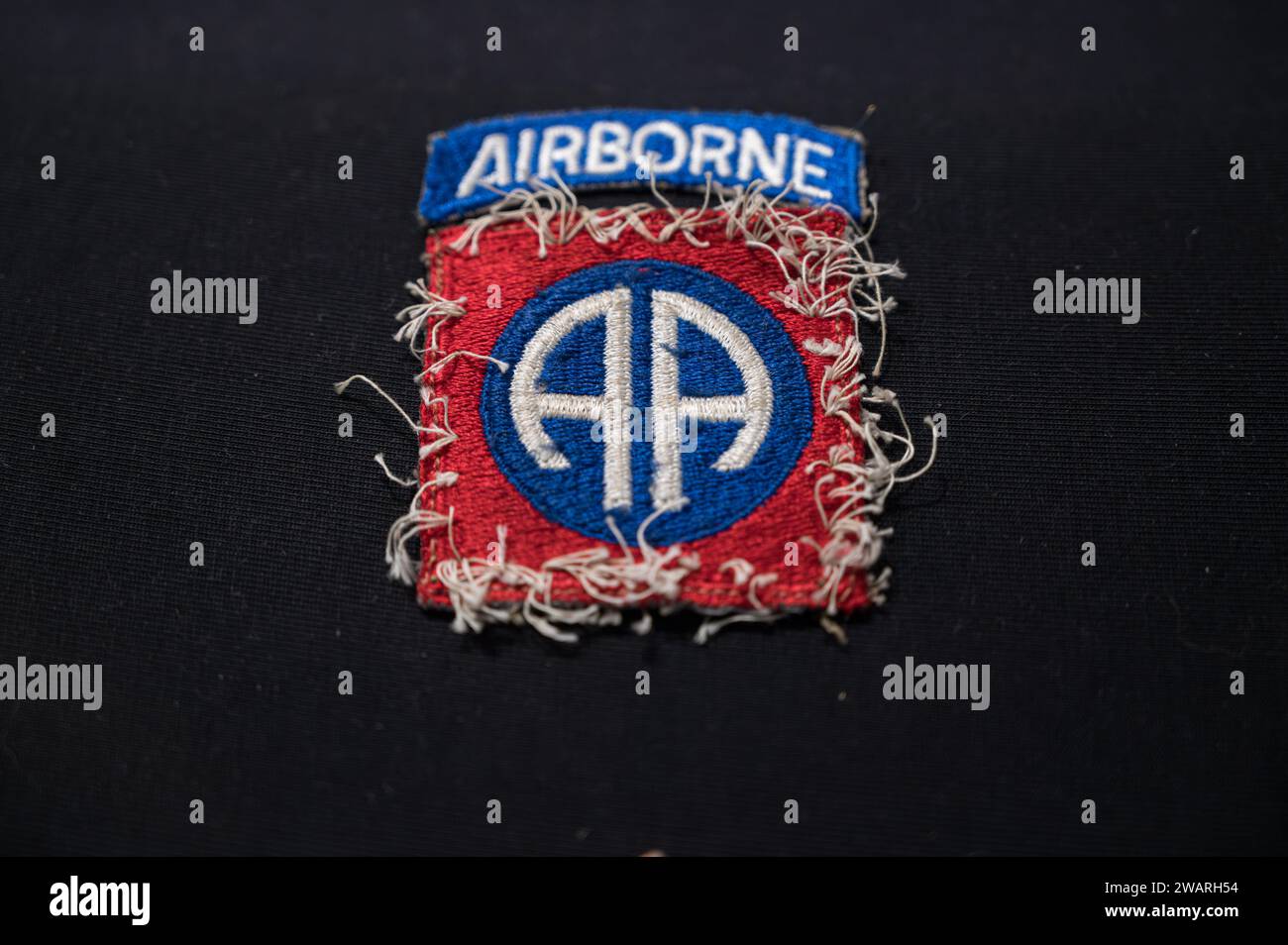 Detail of a worn patch of the 82nd Airborne Division on a black ...