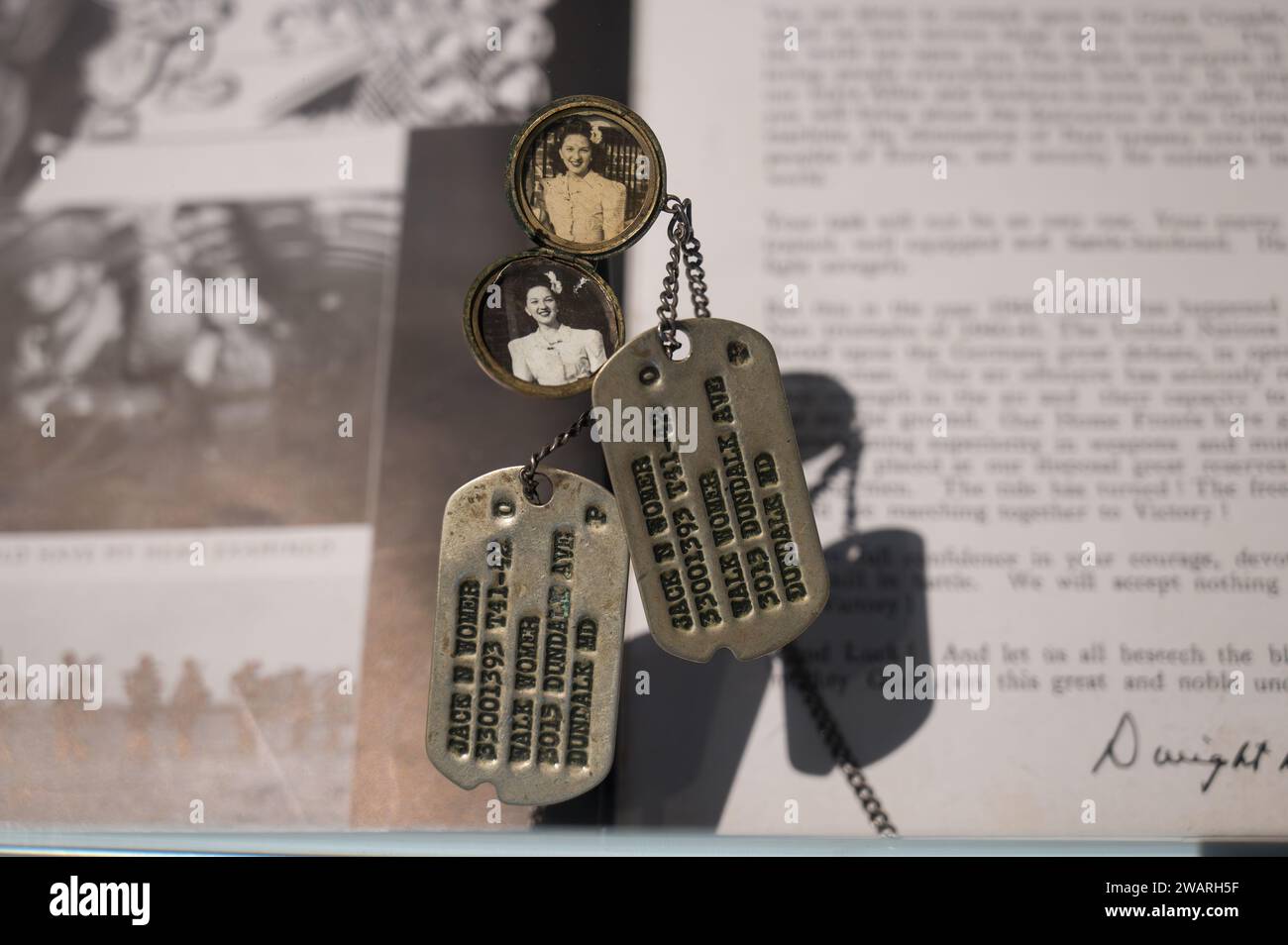 Detail of a soldier's identification chain with a souvenir photo of his ...