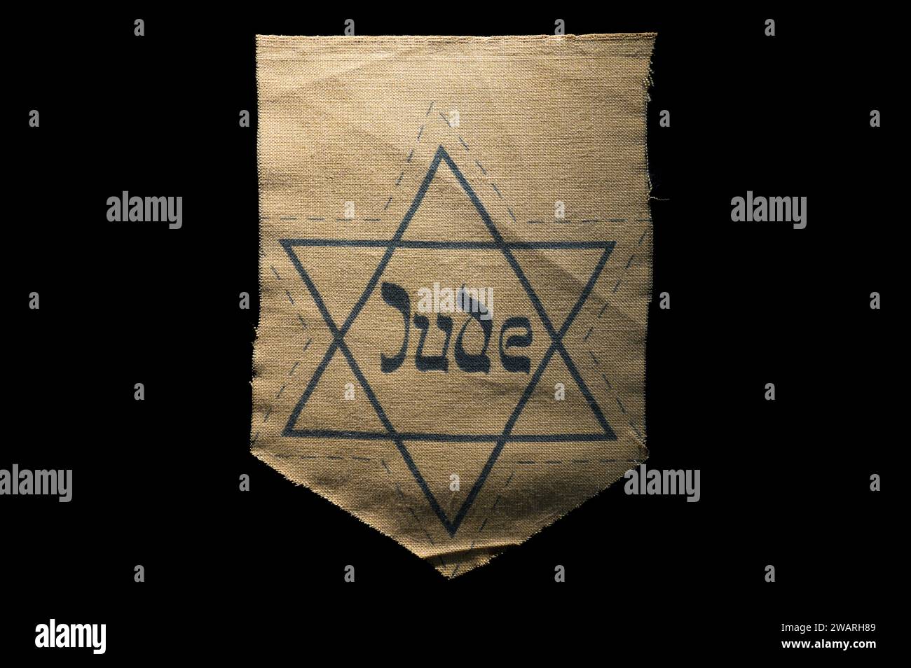 Detail of the Jewish symbol on a textile flag on a black background ...