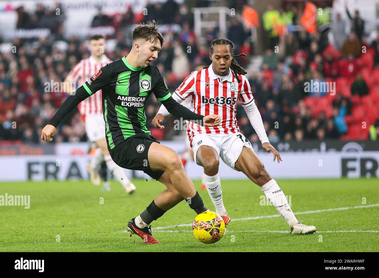 Stoke-on-Trent on Saturday 6th January 2024. Brightons Billy Gilmour ...