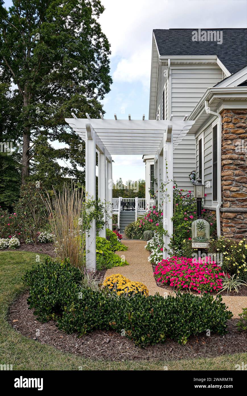 home garden, beside house, flowers, plants, paver path, pergola, steps ...