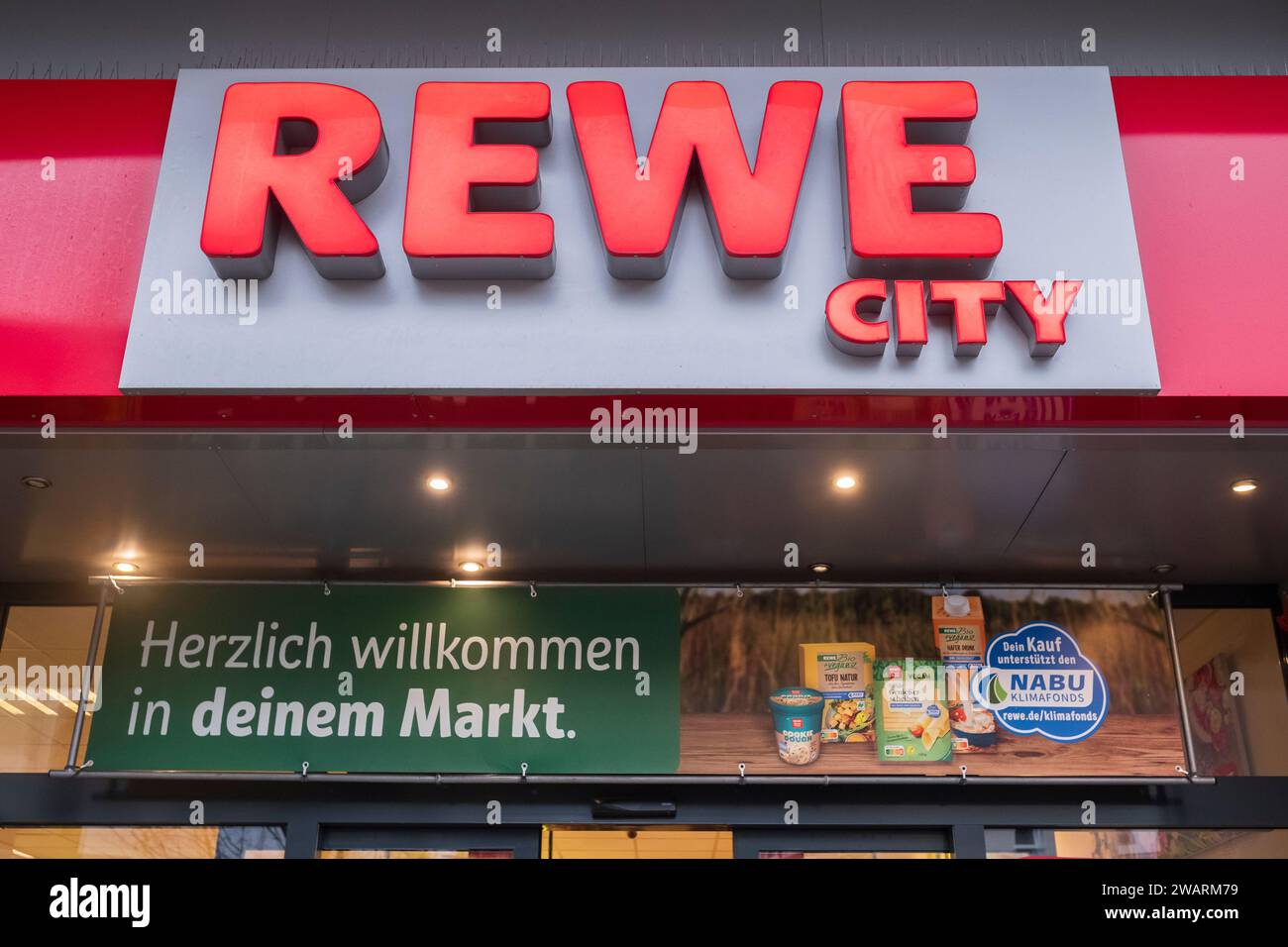 REWE City logo at the entrance of a REWE supermarket in Cologne Stock ...