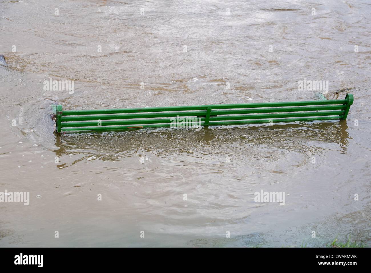 Old Windsor, UK. 6th January, 2024. A submerged bench next to the River ...