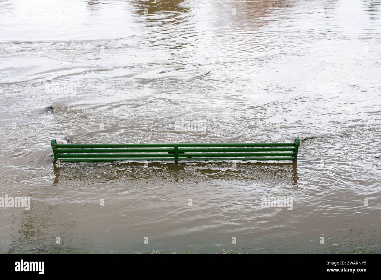 Old Windsor, UK. 6th January, 2024. A submerged bench next to the River ...