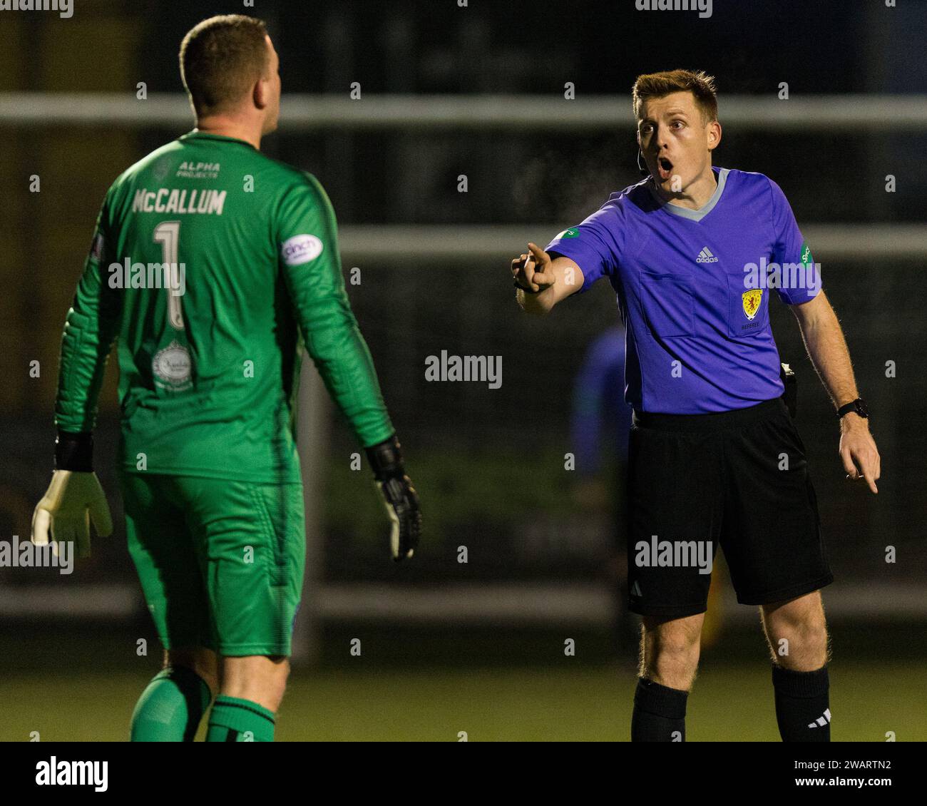 Stenhousemuir, Scotland. 06 January 2024. Ryan Lee speaks to Marc McCallum (GK 1 - Forfar) after ...