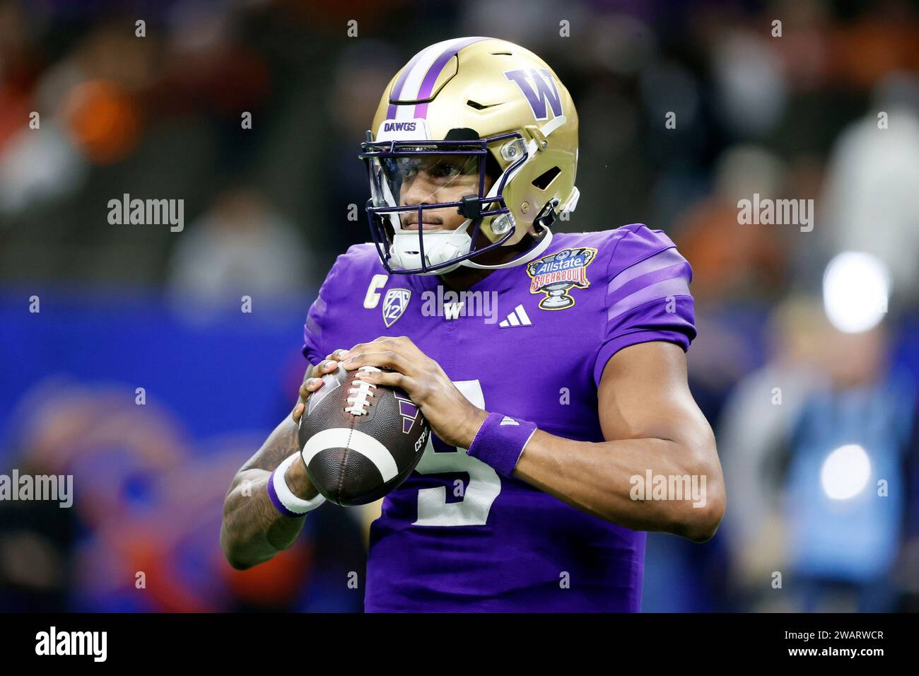 Washington quarterback Michael Penix Jr. warms up before an NCAA college football game Monday ...
