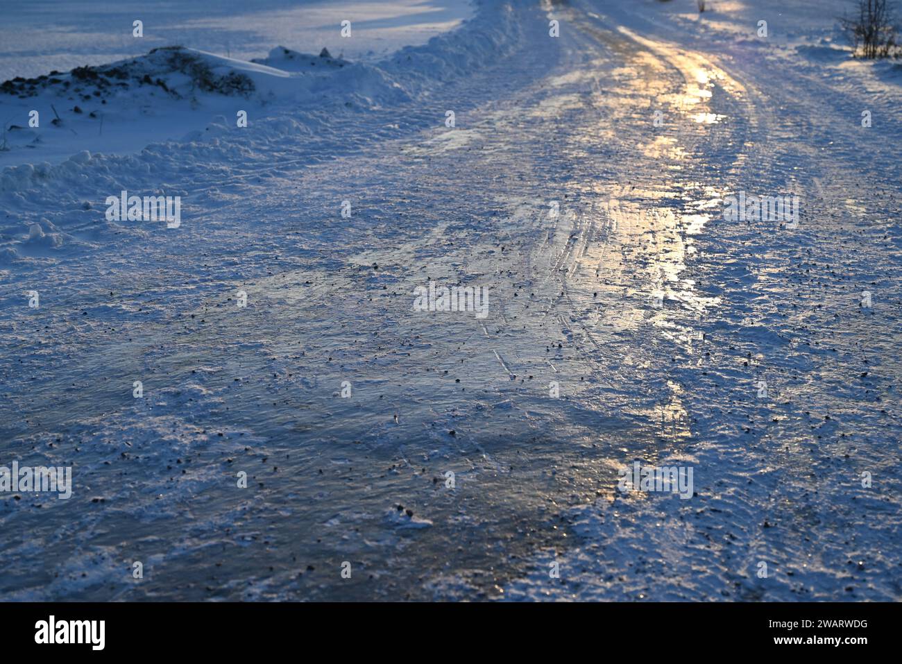 Icy countryside road Stock Photo - Alamy