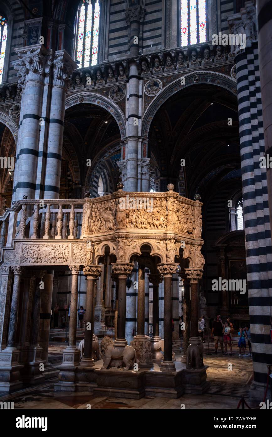 SIENA, ITALY - SEPTEMBER 23, 2023 - Rich ornate marble pulpit in the Siena cathedral in Italy ...