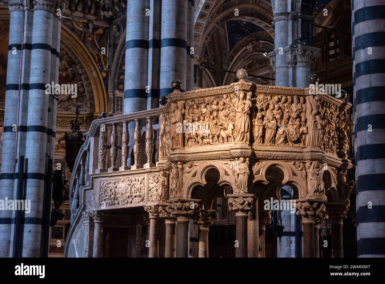 SIENA, ITALY - SEPTEMBER 23, 2023 - Rich ornate marble pulpit in the ...