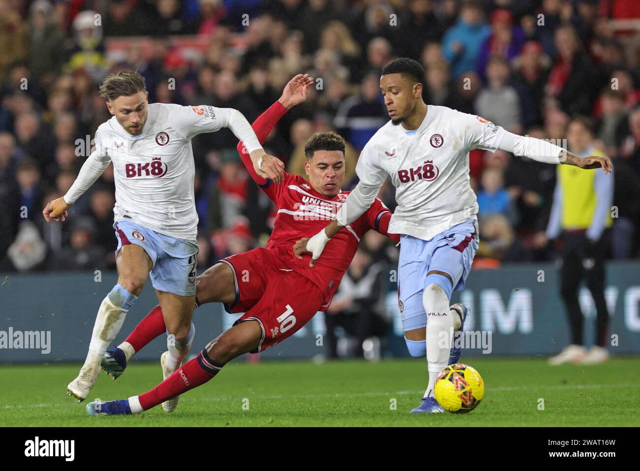 Morgan Rogers of Middlesbrough goes down under a challenge from Matty ...