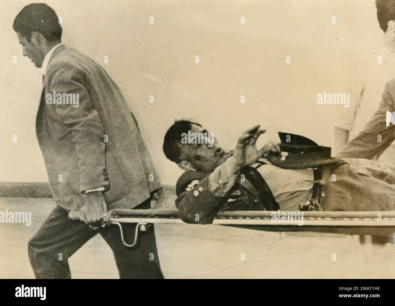 Wounded police officer transported on a stretcher, 1950s Stock Photo ...