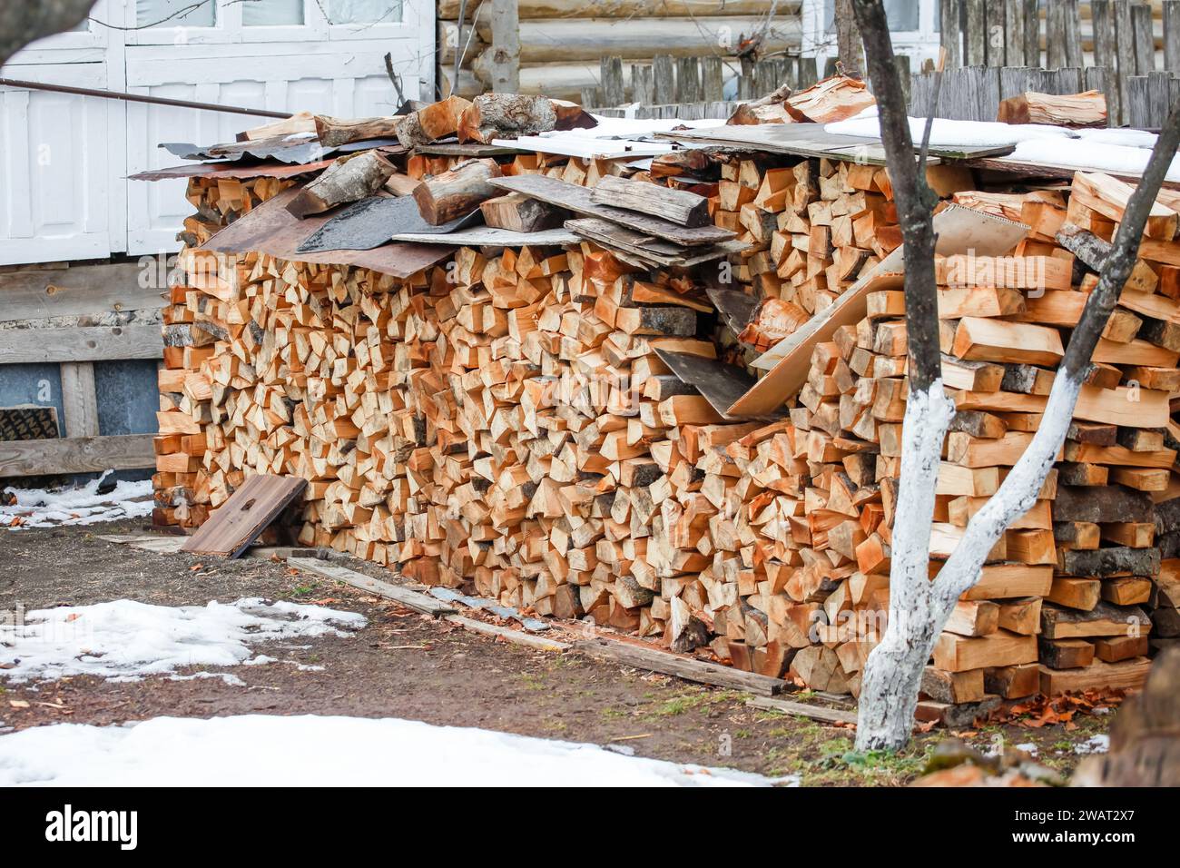 Preparation of firewood for the winter. firewood background Stock Photo ...