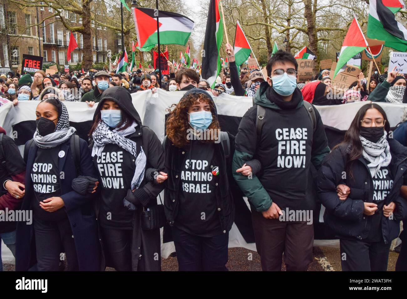 London, UK. 06th Jan, 2024. Protesters wearing shirts with the slogans ...