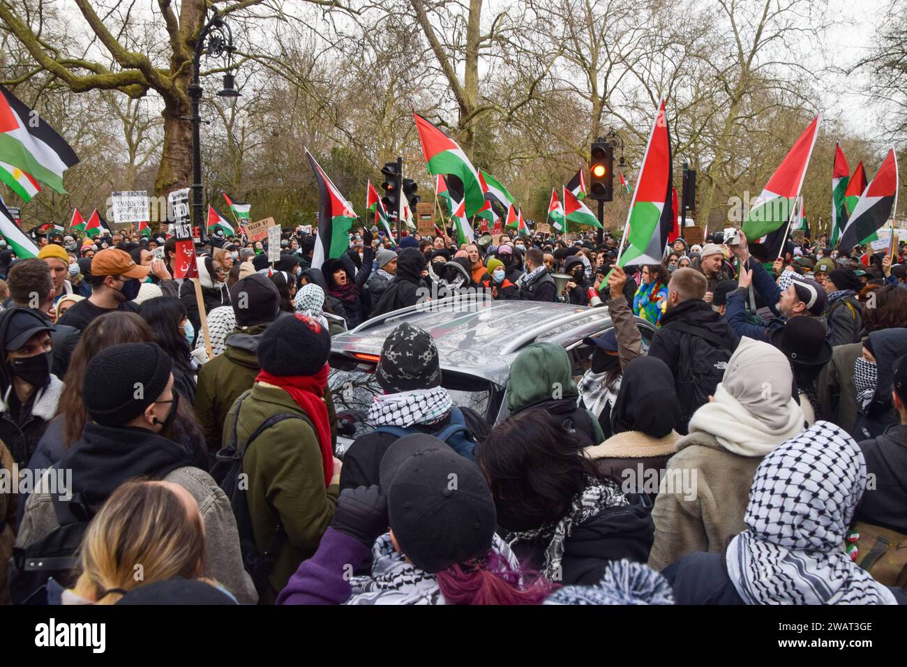 London, UK. 06th Jan, 2024. Protesters holding Palestinian flags ...
