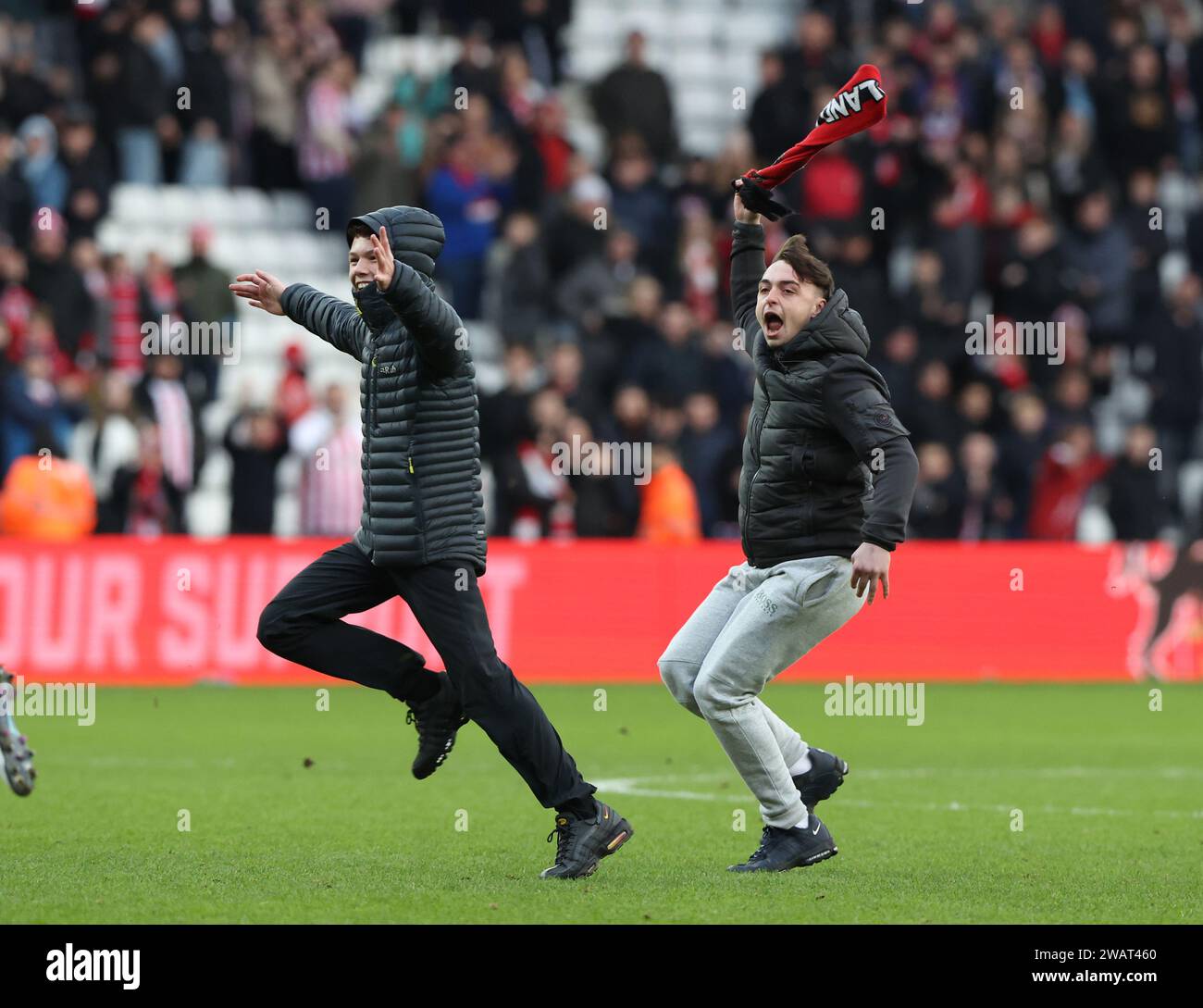 Sunderland, UK. 6th Jan, 2024. Fans run on the pith after the The FA ...