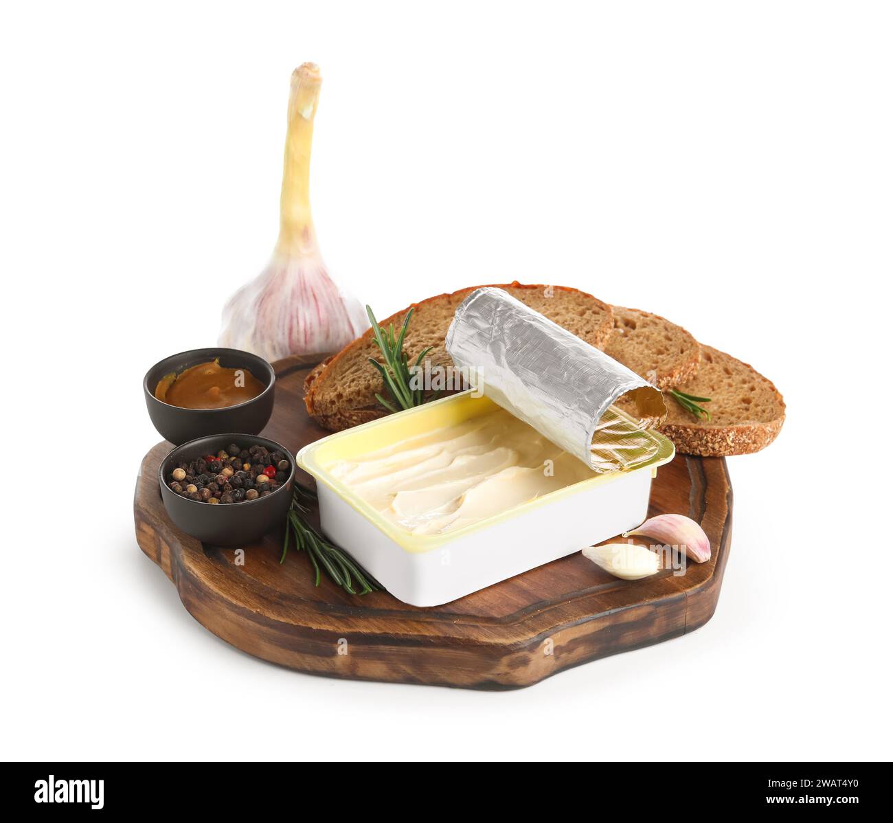 Wooden board with box of processed cheese, bread and garlic isolated on ...