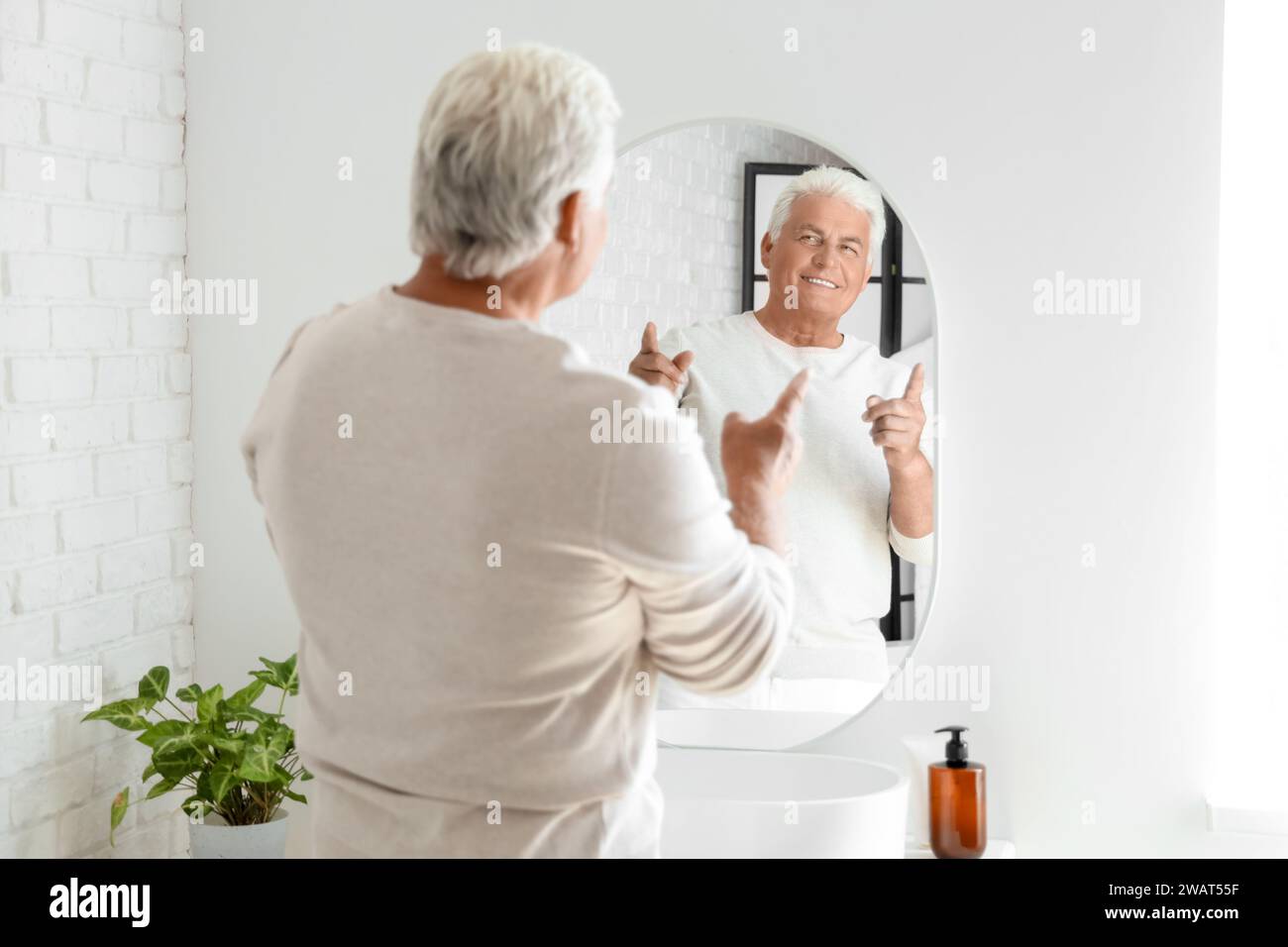 Elderly man back view mirror hi-res stock photography and images - Alamy