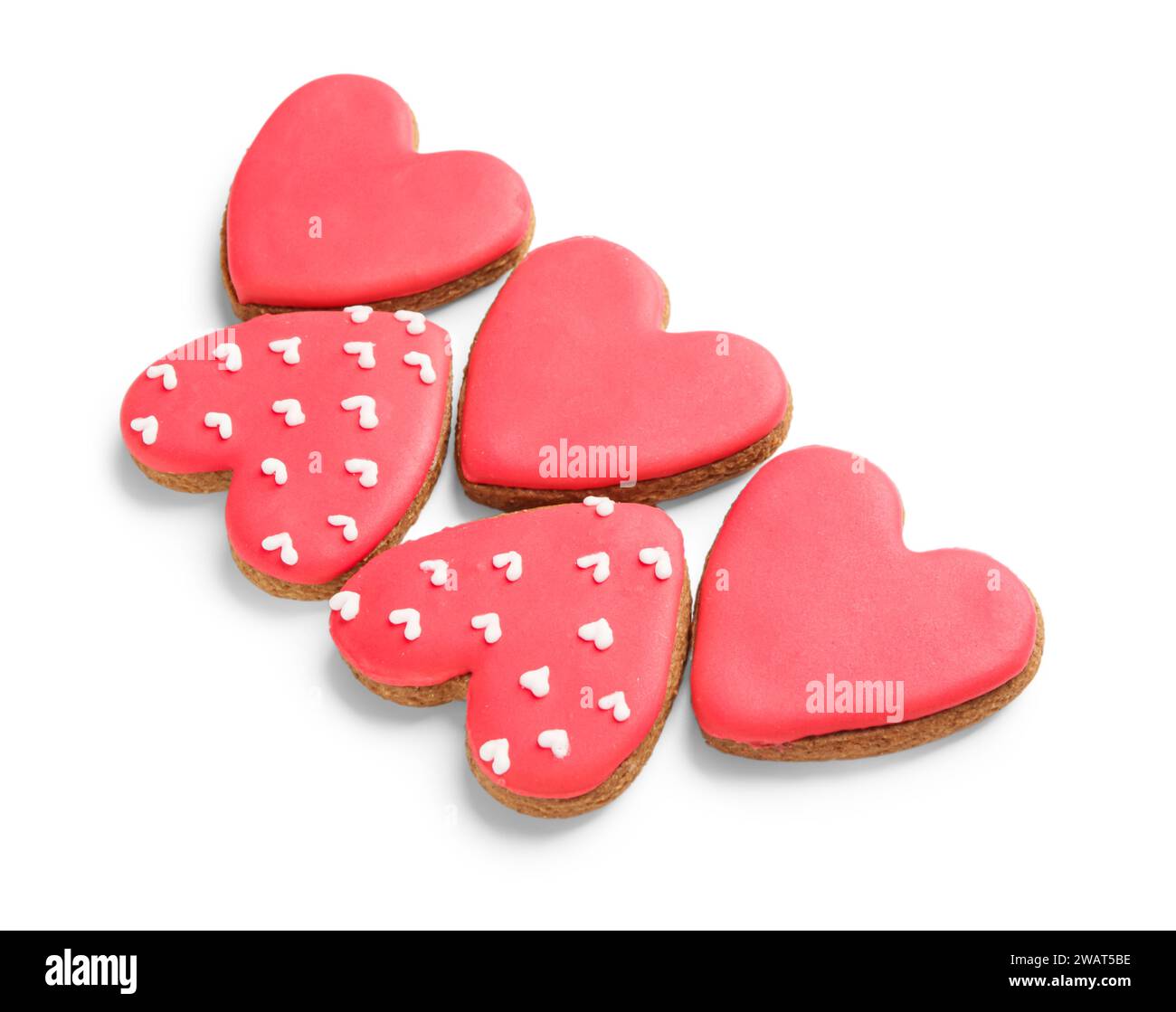 Red sweet heart shaped cookies on white background Stock Photo - Alamy
