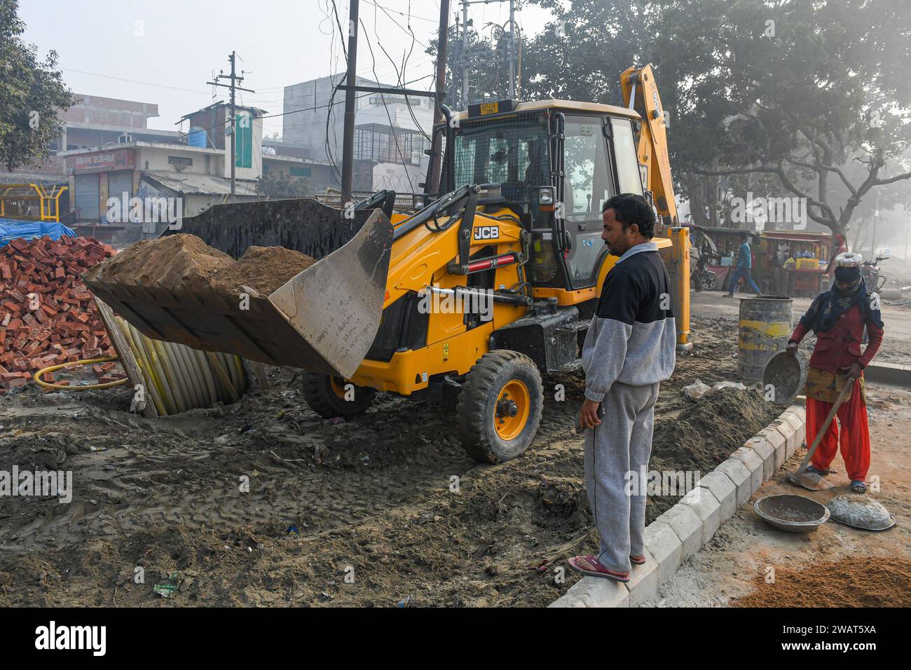 Labourers work near a construction site ahead of Indian Prime Minister ...