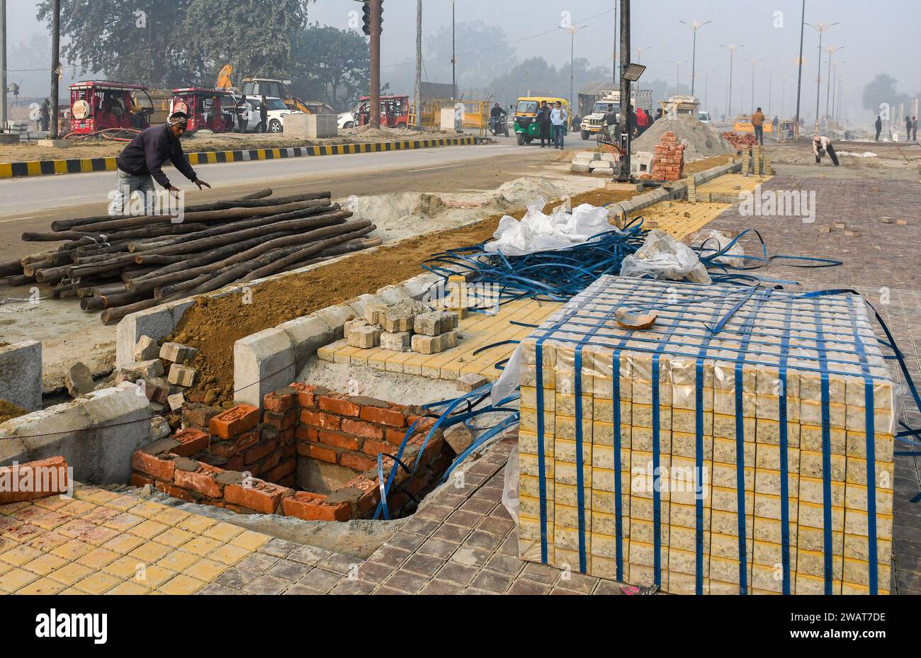 Ayodhya, India. 27th Dec, 2023. Building materials are laid over a ...