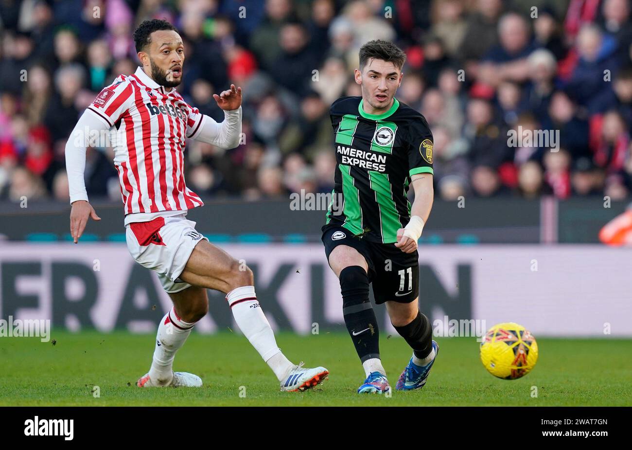 Stoke, UK. 6th Jan, 2024. Lewis Baker of Stoke City (L) challenges ...