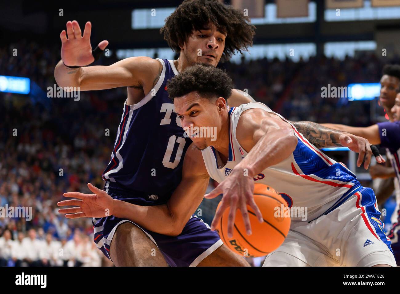 Kansas guard Kevin McCullar Jr., right, drives against TCU guard Micah ...
