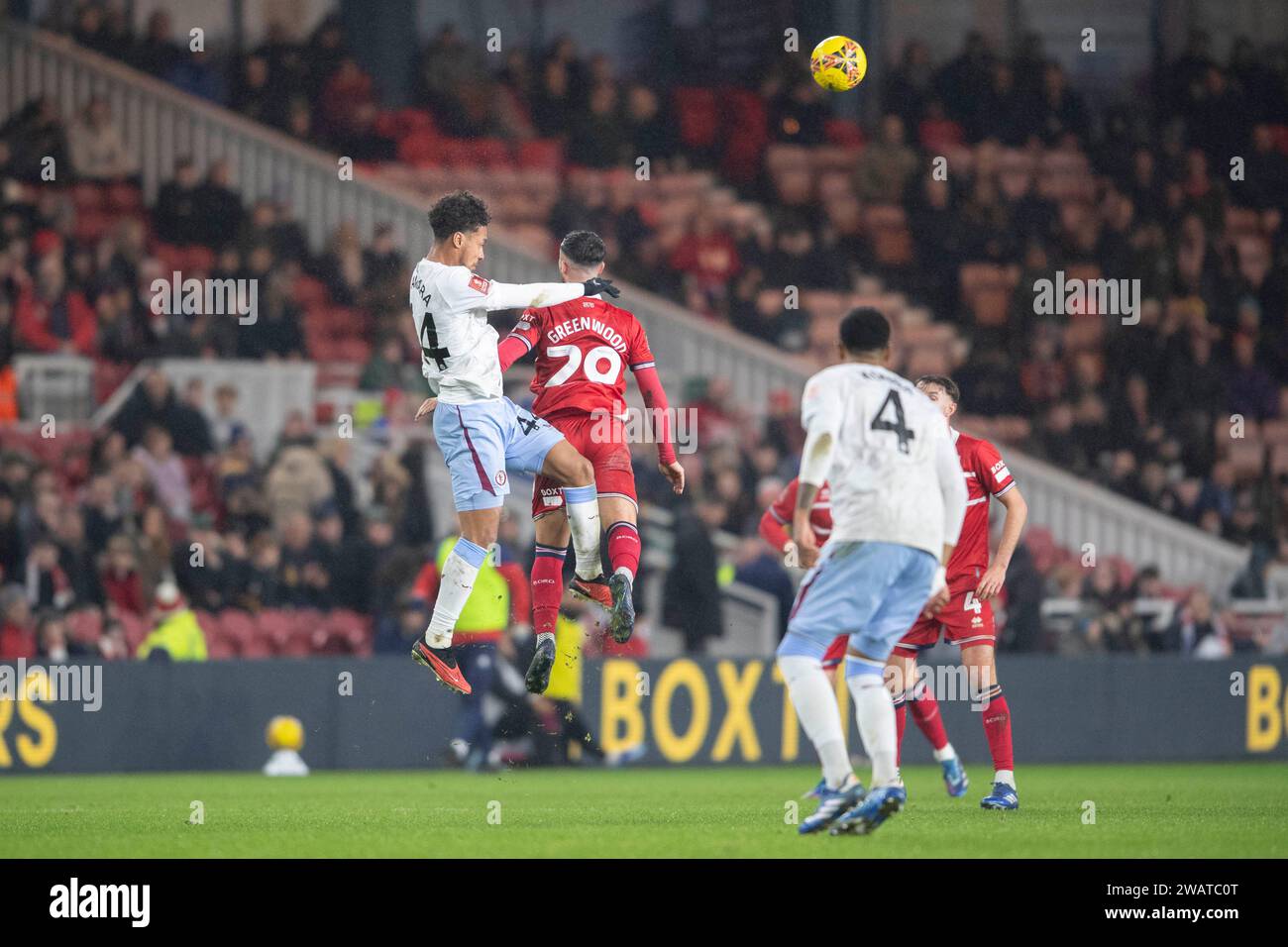 Aston Villa's Boubacar Kamara heads the ball clear under pressure from ...