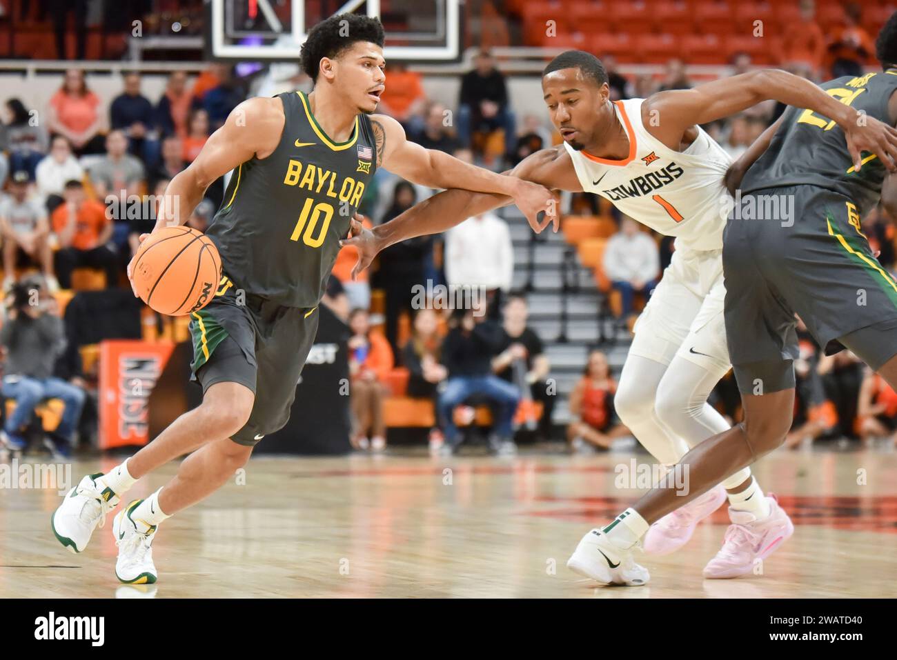 Baylor guard RayJ Dennis (10) pushes past Oklahoma State guard Bryce ...