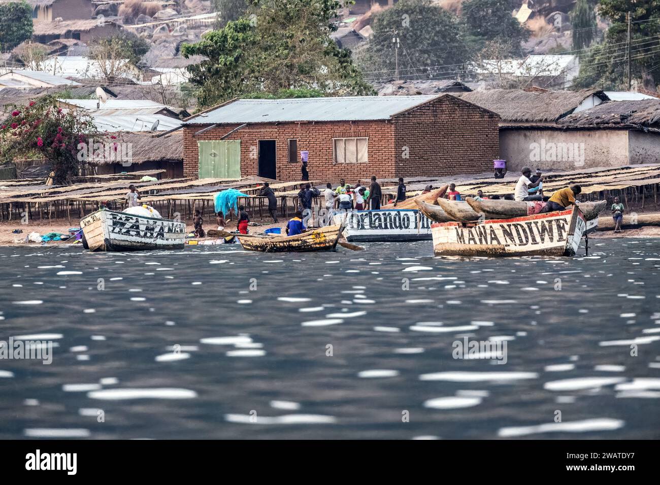 Fishermen, Dusk, fish drying platforms, Chembe fishing village ...
