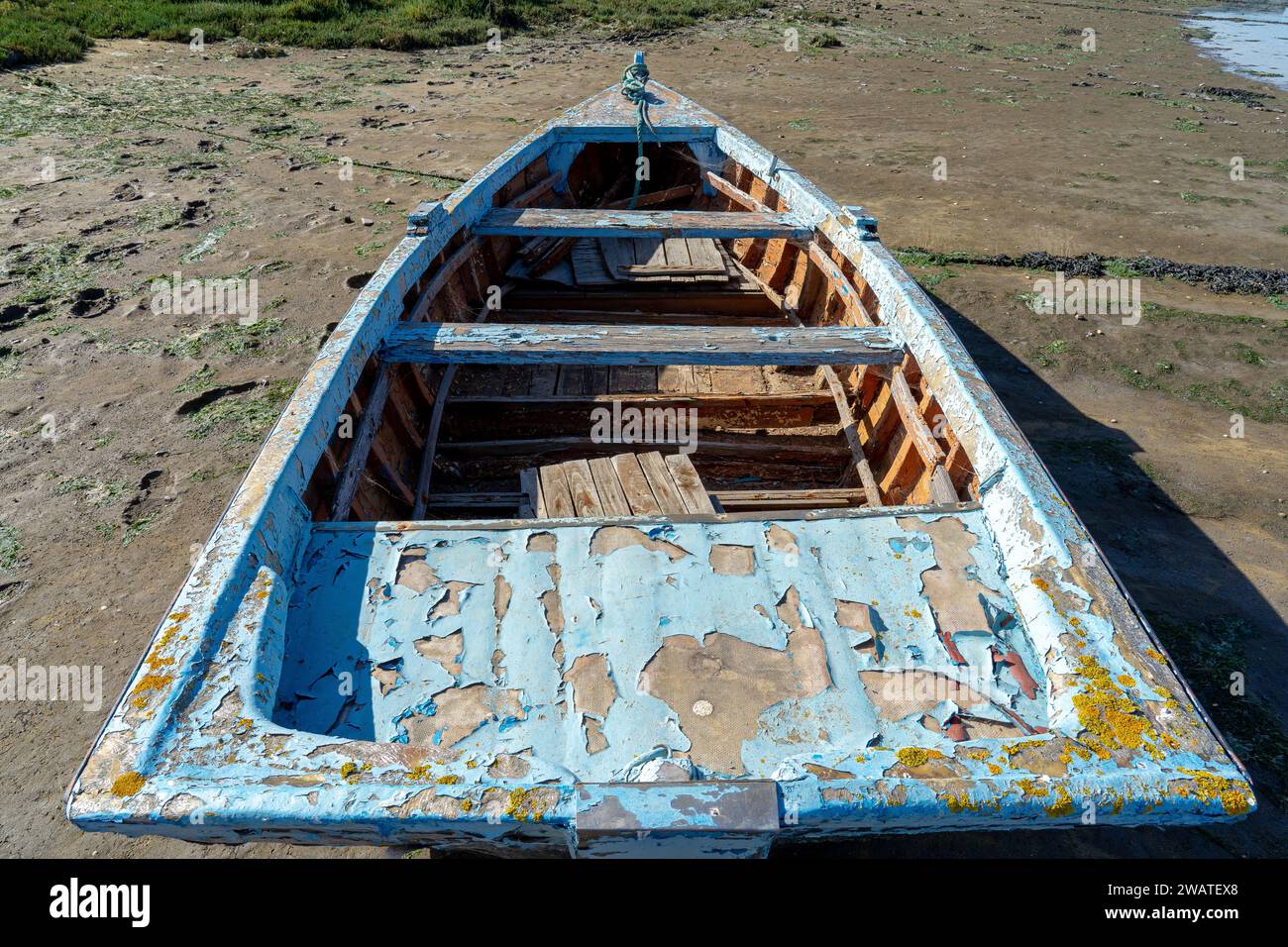 old artisanal wooden fishing boat in a phase of degradation on top of ...
