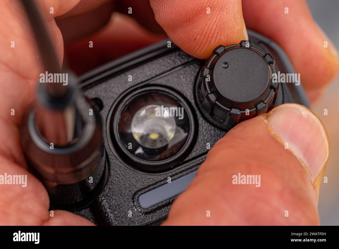 Baofeng BF-21 portable amateur radio held in the hand of a white person ...