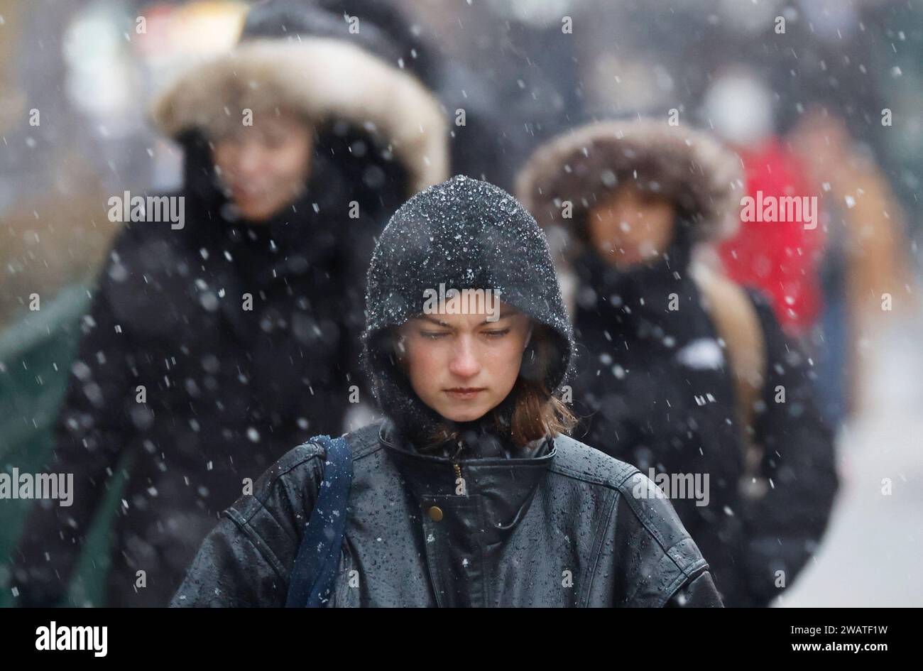 New York, United States. 06th Jan, 2024. Pedestrians bundled up and ...