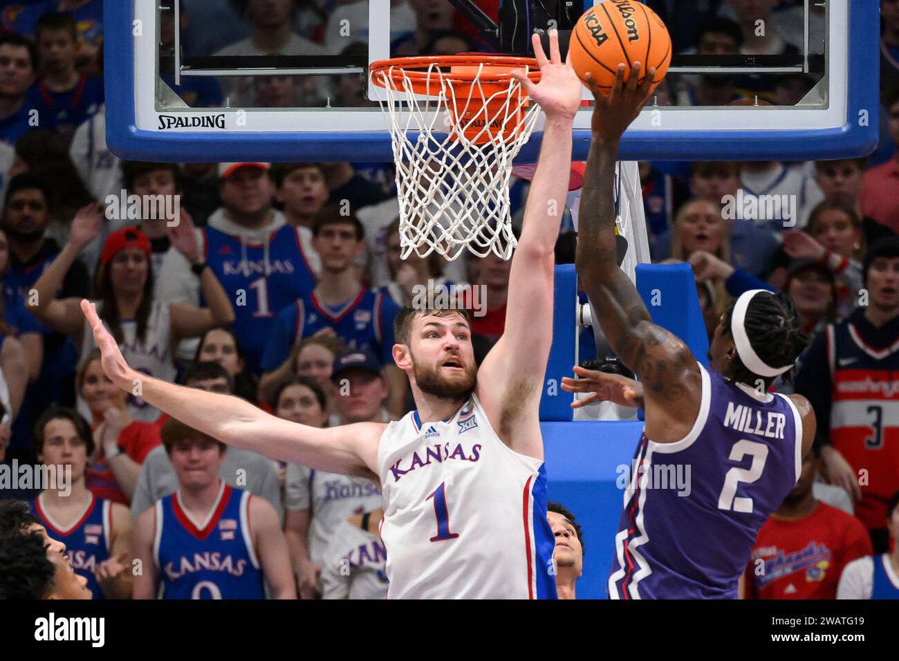 Kansas center Hunter Dickinson (1) tries to block a shot by TCU forward ...