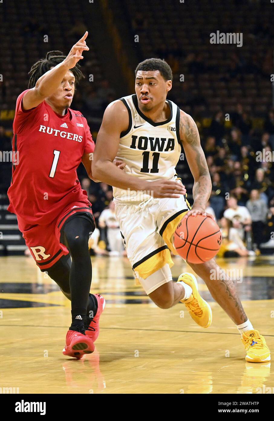 IOWA CITY, IA - JANUARY 06: Iowa guard Tony Perkins (11) drives to the ...